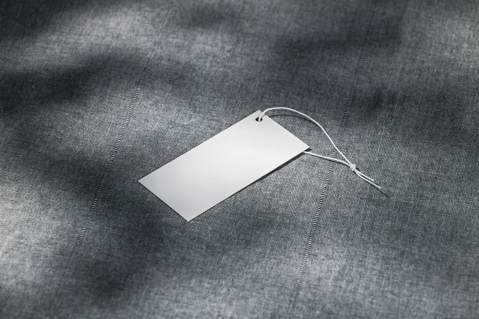 Label tag on grey material mockup - Mockups Design