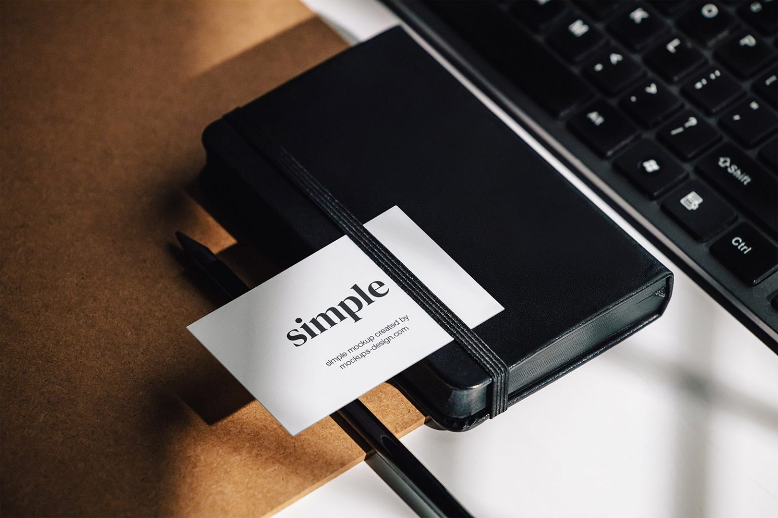 Business card on the black notepad - Mockups Design