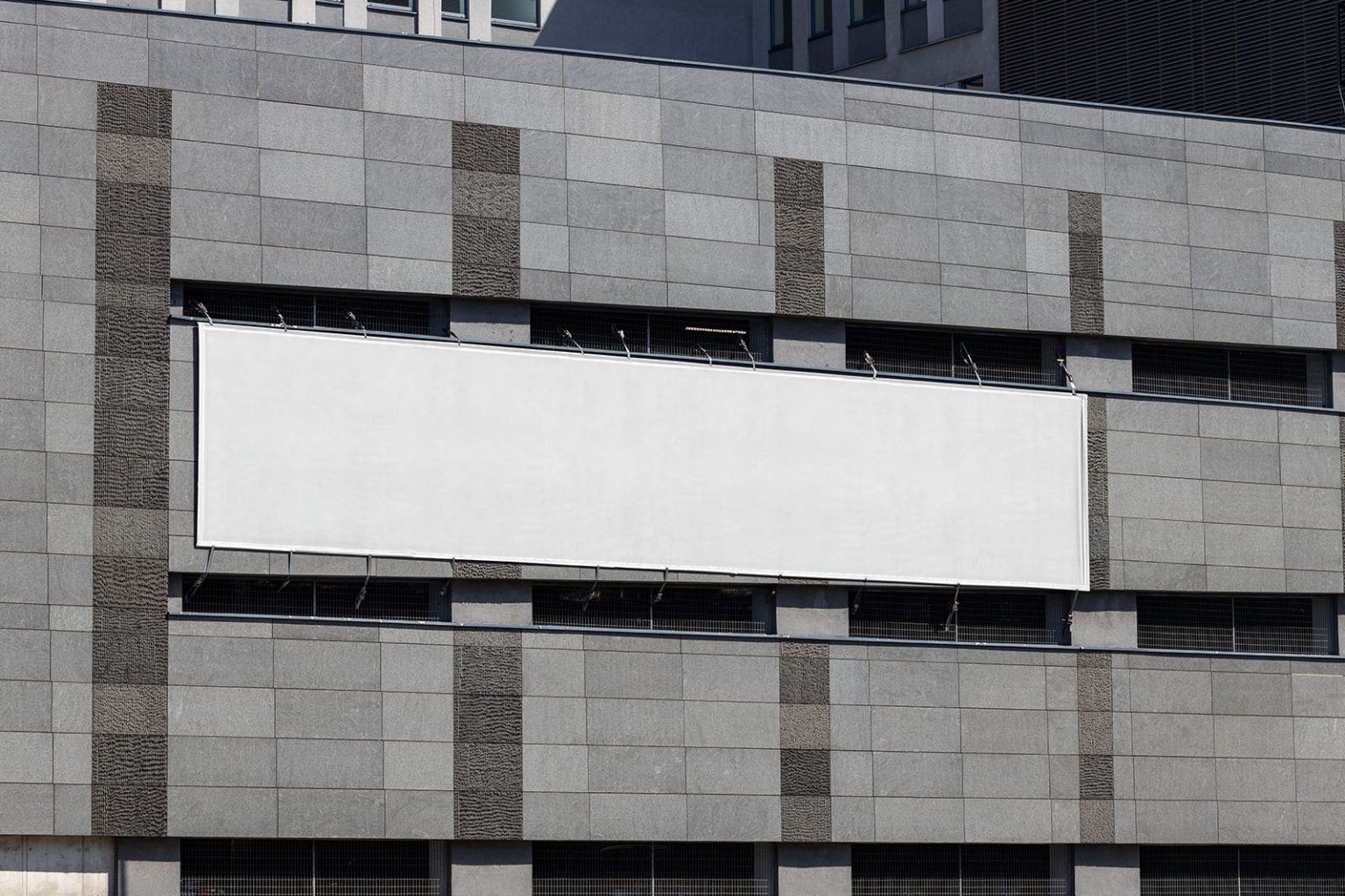 Large banner on grey building mockup - Mockups Design